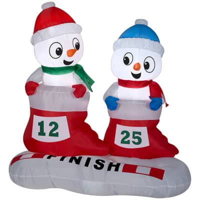 4ft. Airblown® Inflatable Christmas Snowman in Stocking Races | Michaels