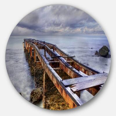 Designart - Old Rusty Pier in Cloudy Day' Seashore Photo Circle Metal ...